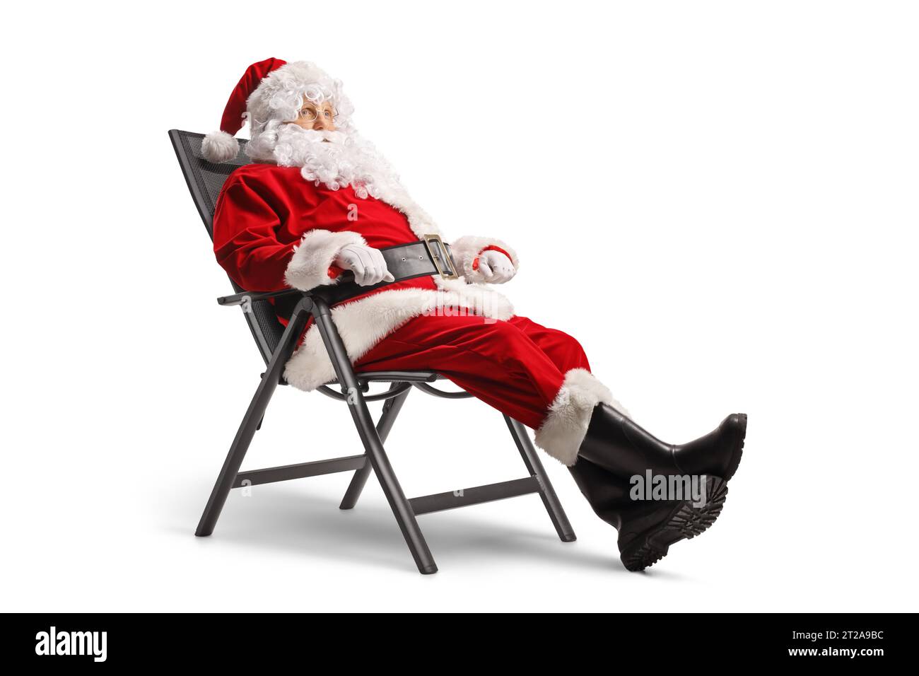 Santa claus resting in a foldable chair isolated on white background ...