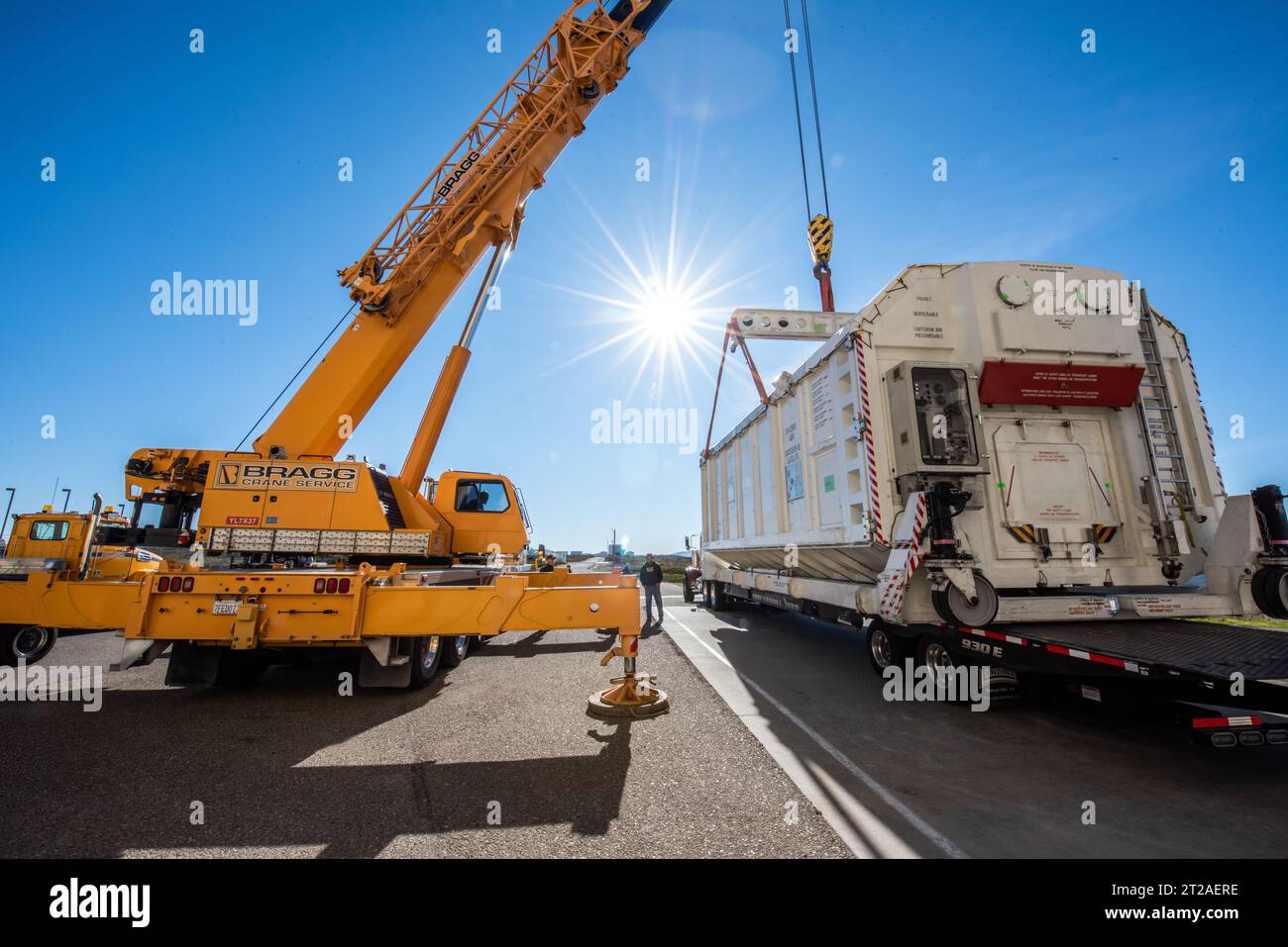 SWOT Spacecraft Transport Container Move to Trailer. A container, with ...