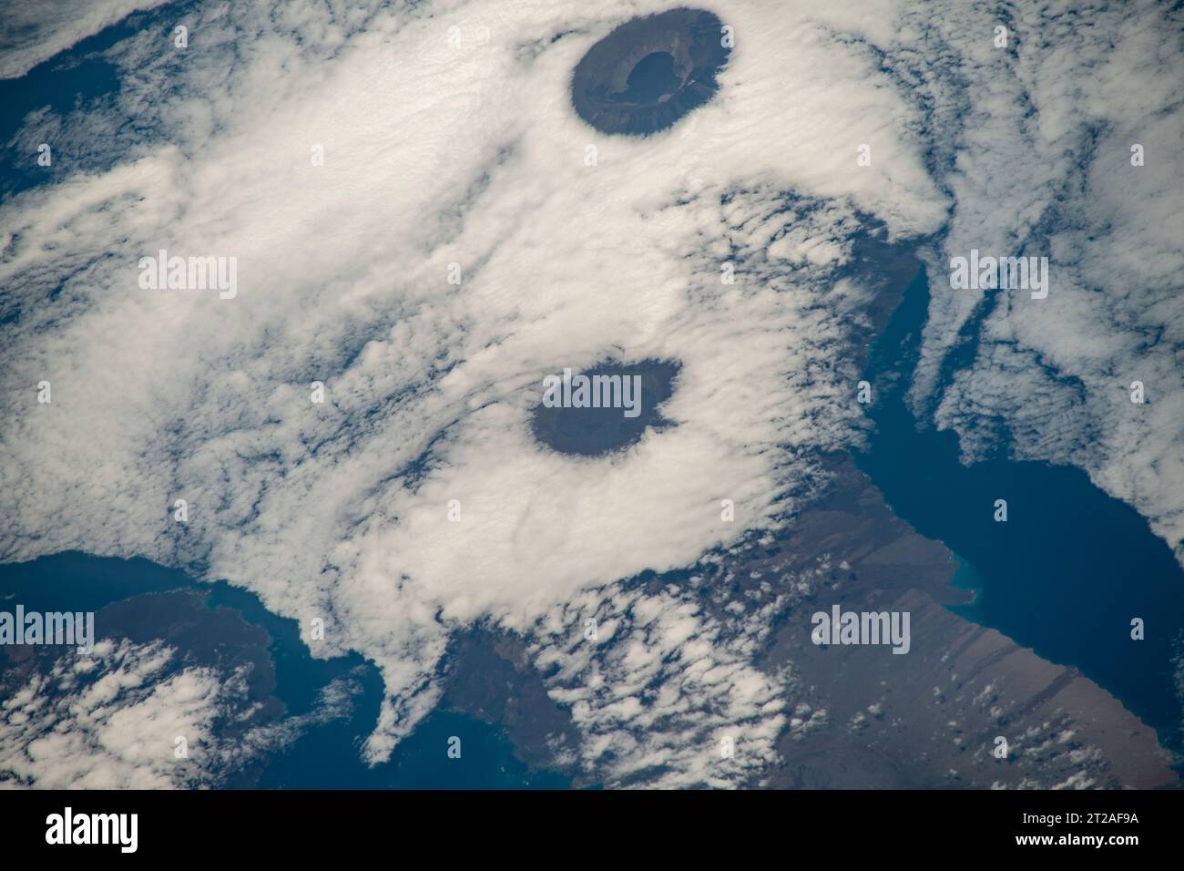 . iss068e025399 (Nov. 28, 2022) --- From top, the peaks of Wolf Volcano ...