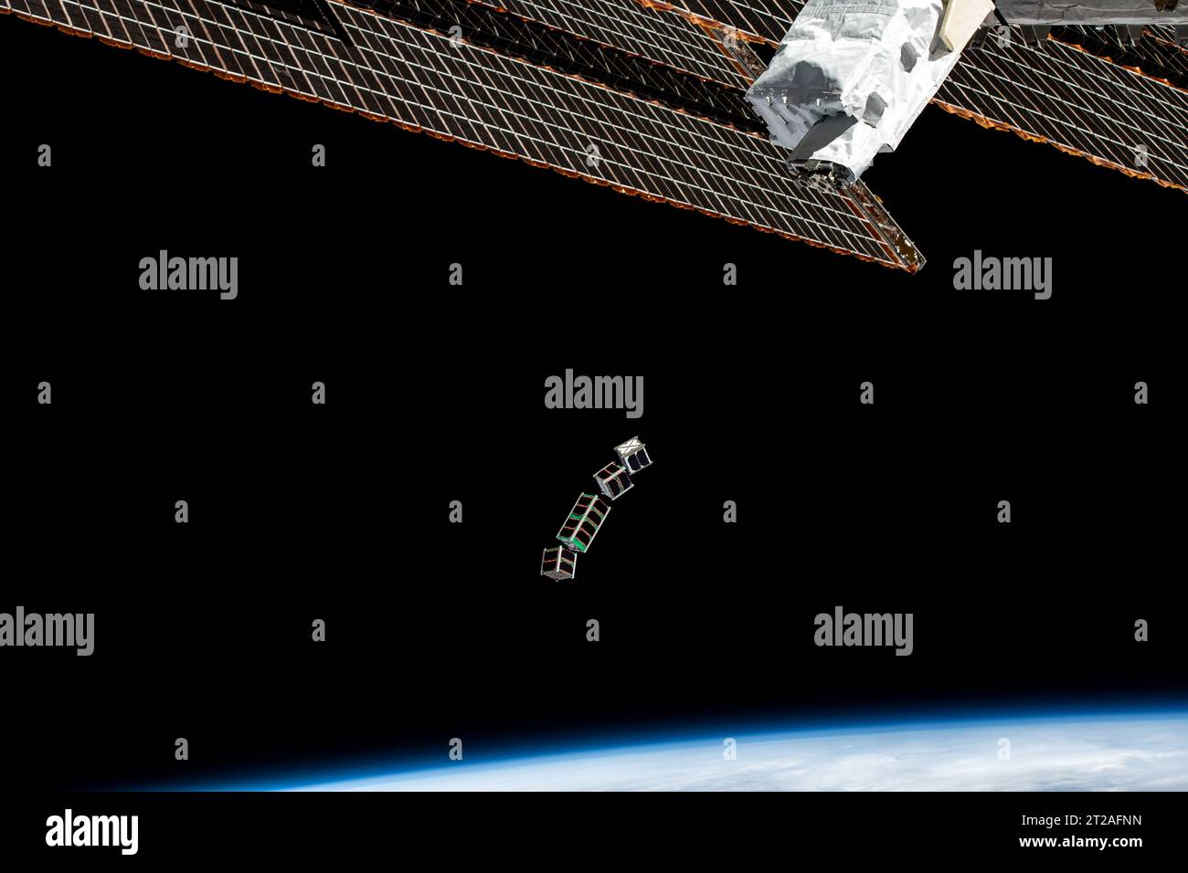 Four CubeSats from Japan, Uganda, and Zimbabwe are deployed from the ...