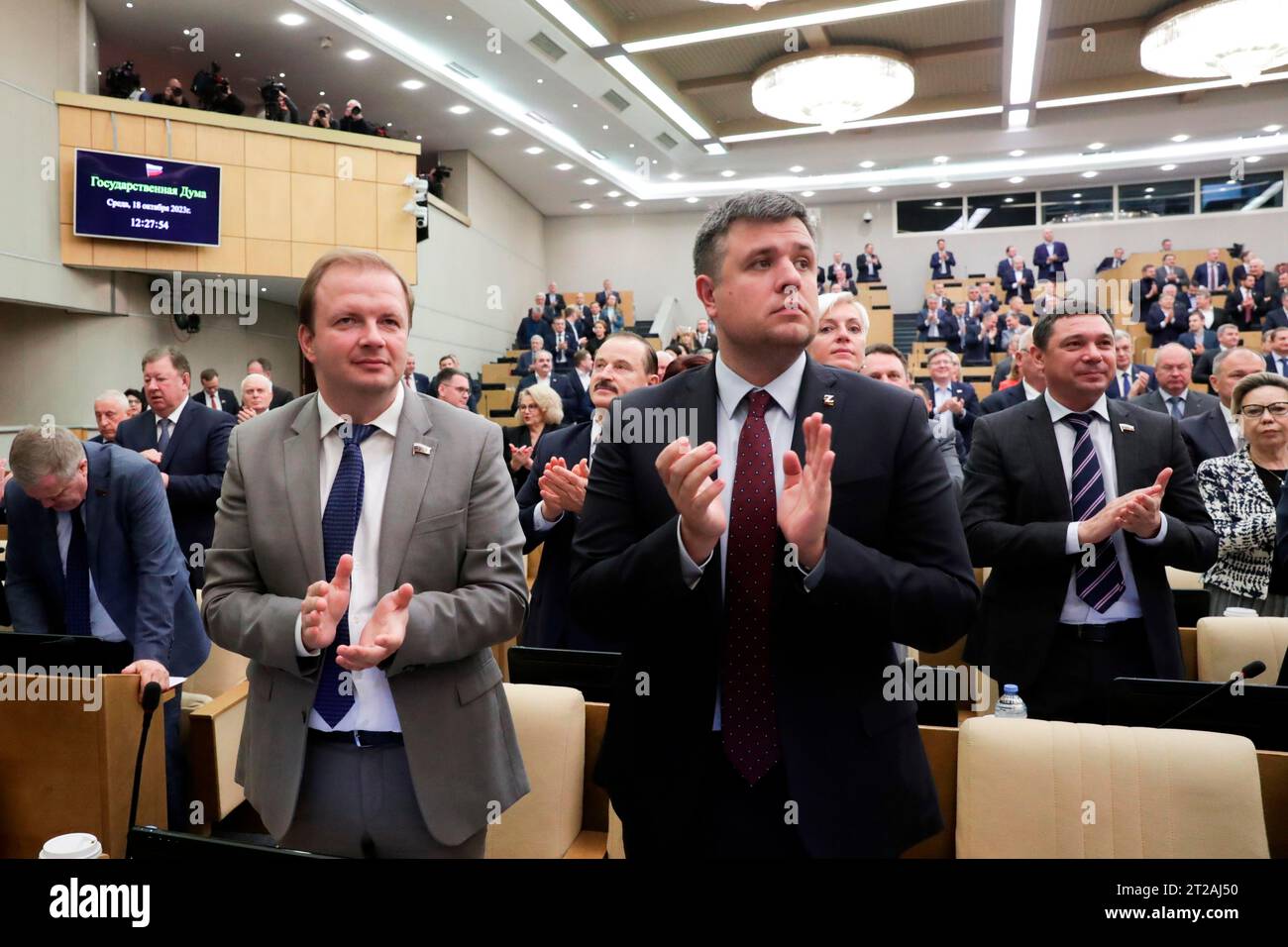In this photo released by The State Duma, Russian lawmakers applaud ...
