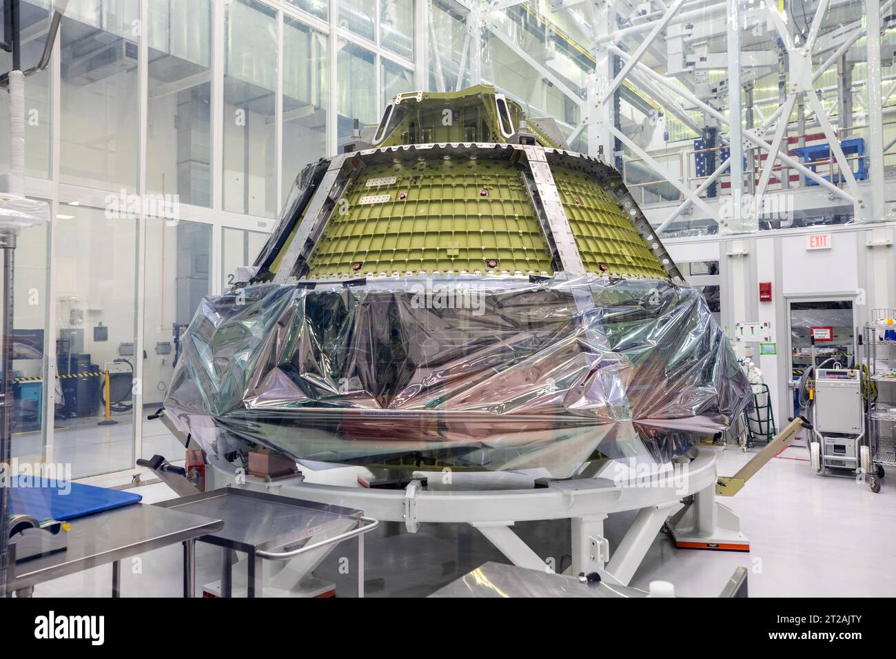 Artemis III Orion Crew Module. A protective wrapping is being removed ...