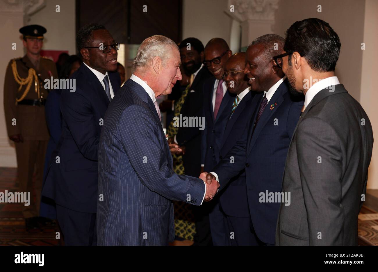 Britain's King Charles III, center, shakes hands as he welcomes Kenyan ...