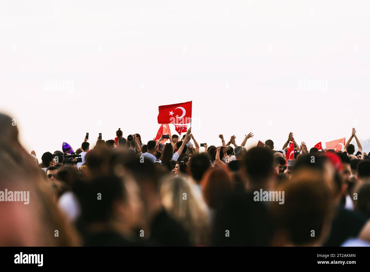 Izmir, Turkey - September 9, 2023: A jubilant crowd waves multiple ...