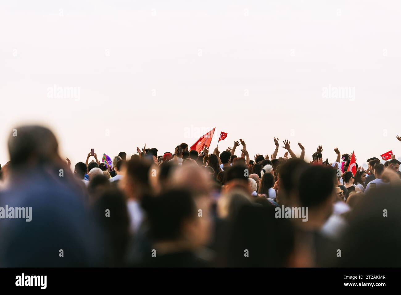 Izmir, Turkey - September 9, 2023: A jubilant crowd waves multiple ...