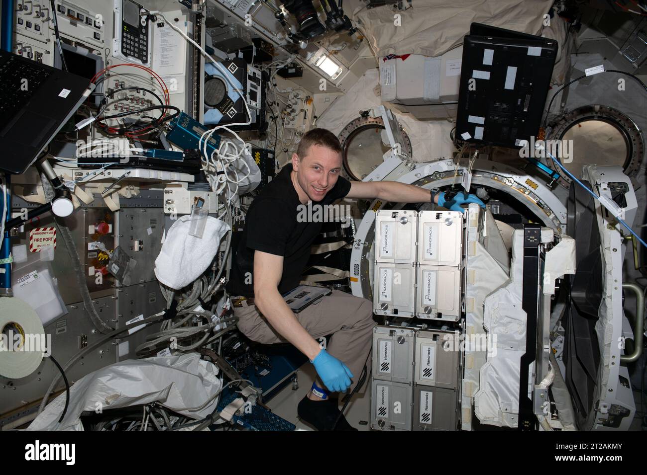 Hoburg removing the Nanoracks Cubesat Deployer from the Kibo Laboratory ...