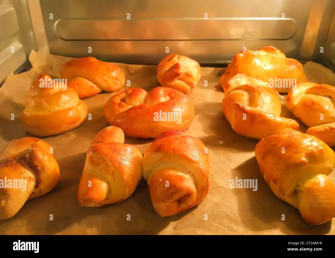 Homemade pastry in the oven in cooking process Stock Photo - Alamy
