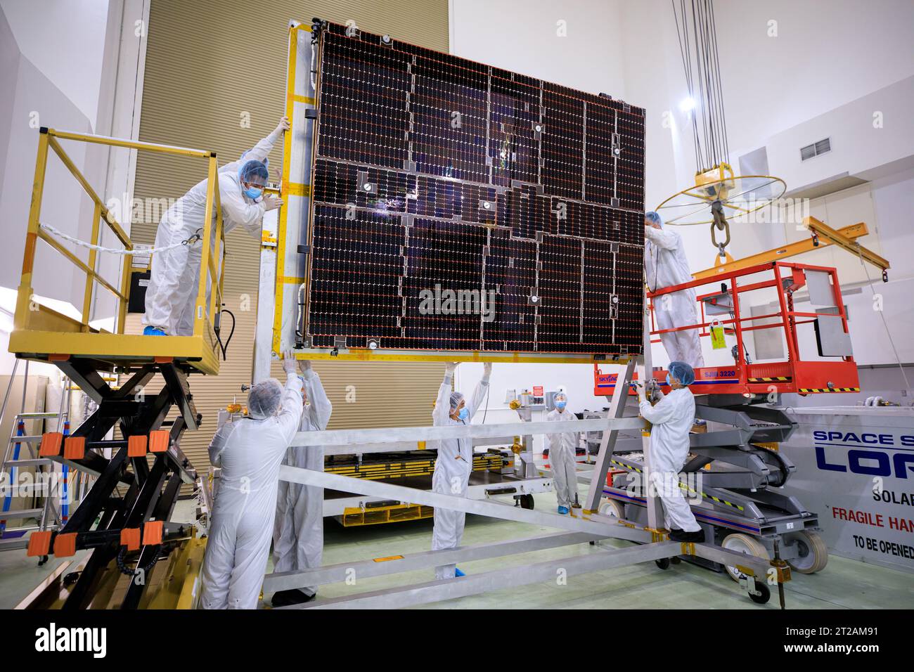Psyche Solar Array Unboxing. A NASA team helps attach solar arrays for ...