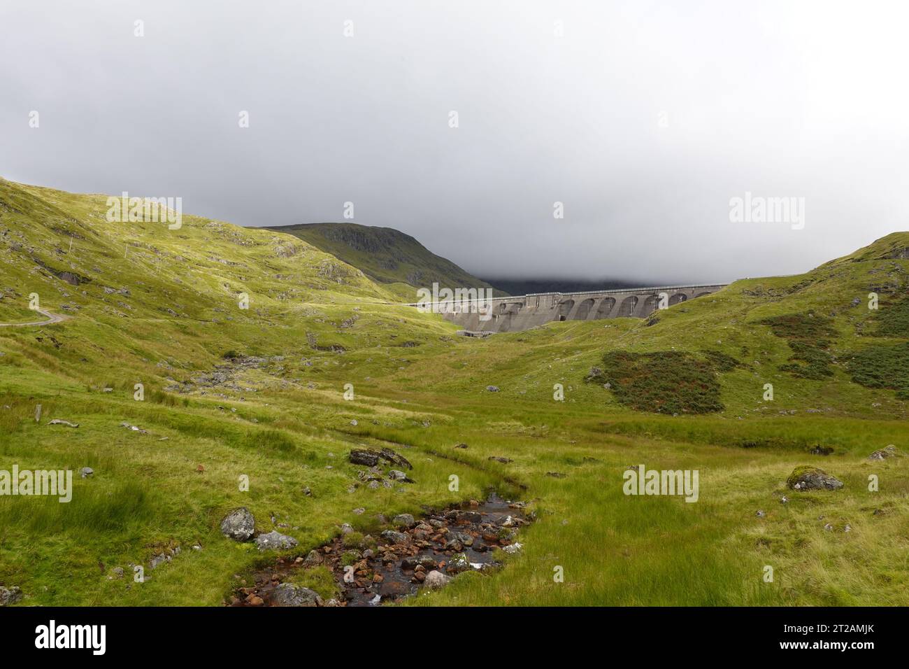 Cruachan Dam at Cruachan reservoir below Munro mountain Ben Cruachan ...