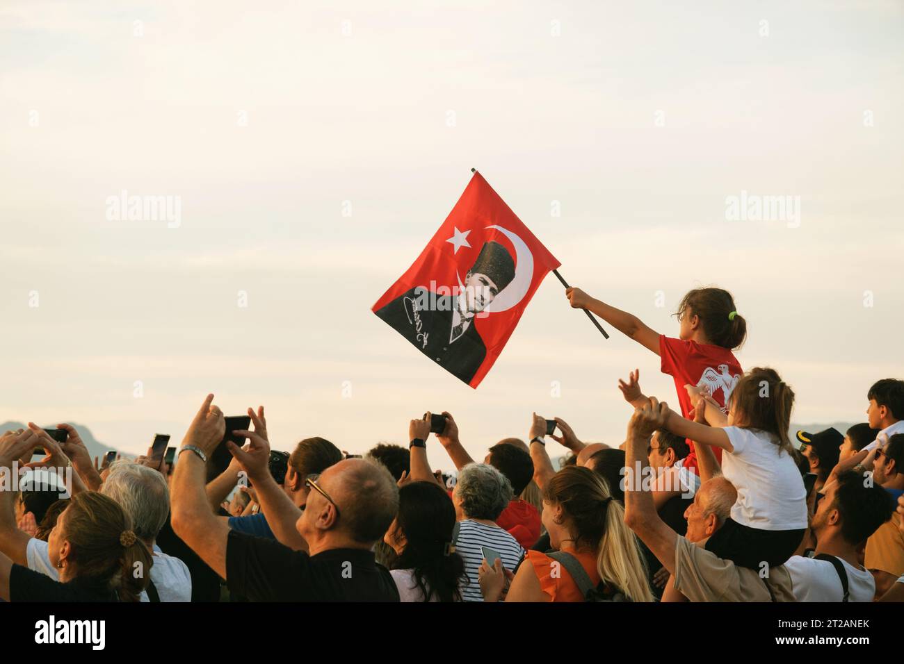 Izmir, Turkey, September 9, 2023: Amidst the bustling crowd, a young ...