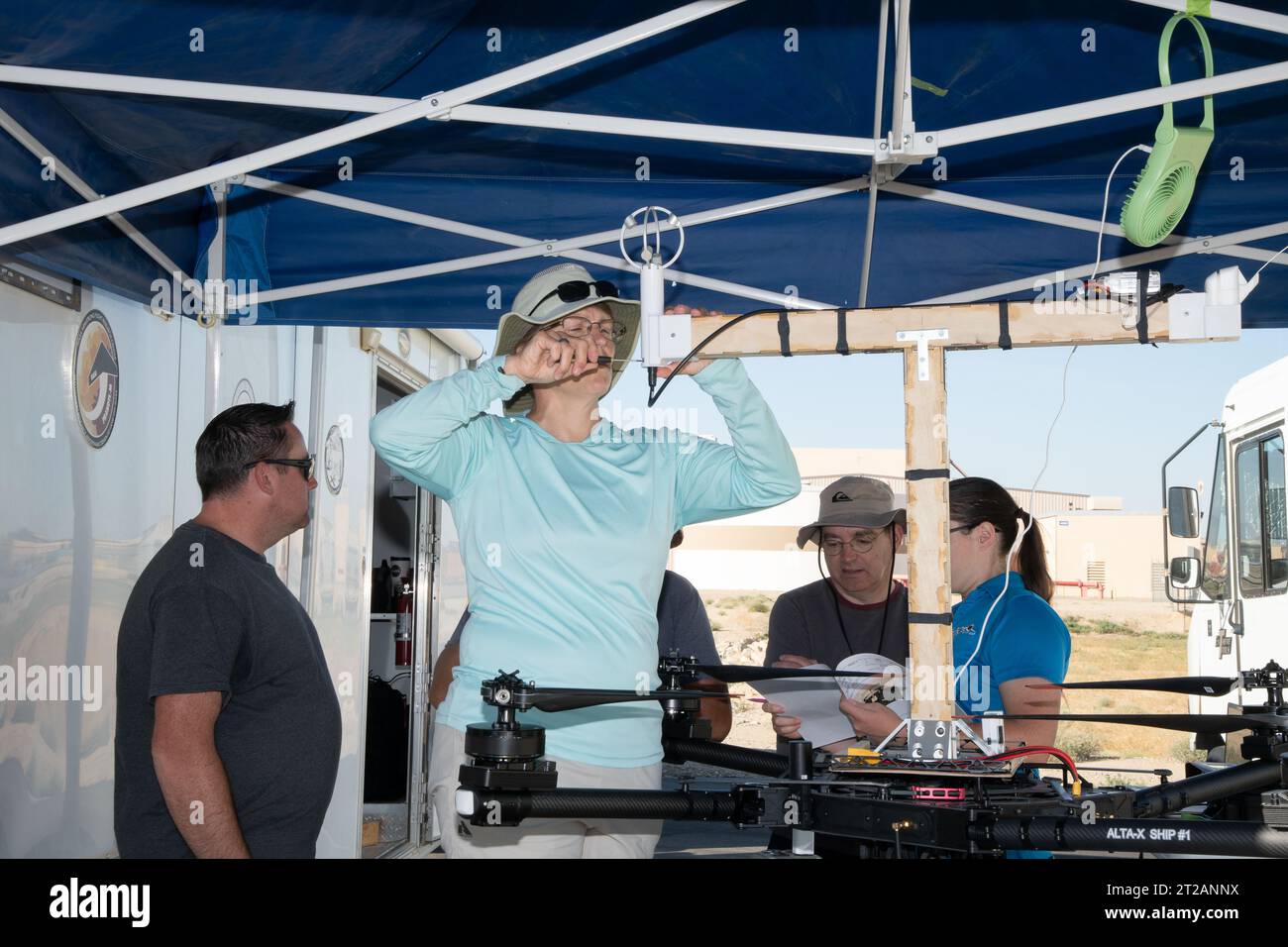 . Jennifer Fowler works on securing sensors onto the test fixture on ...