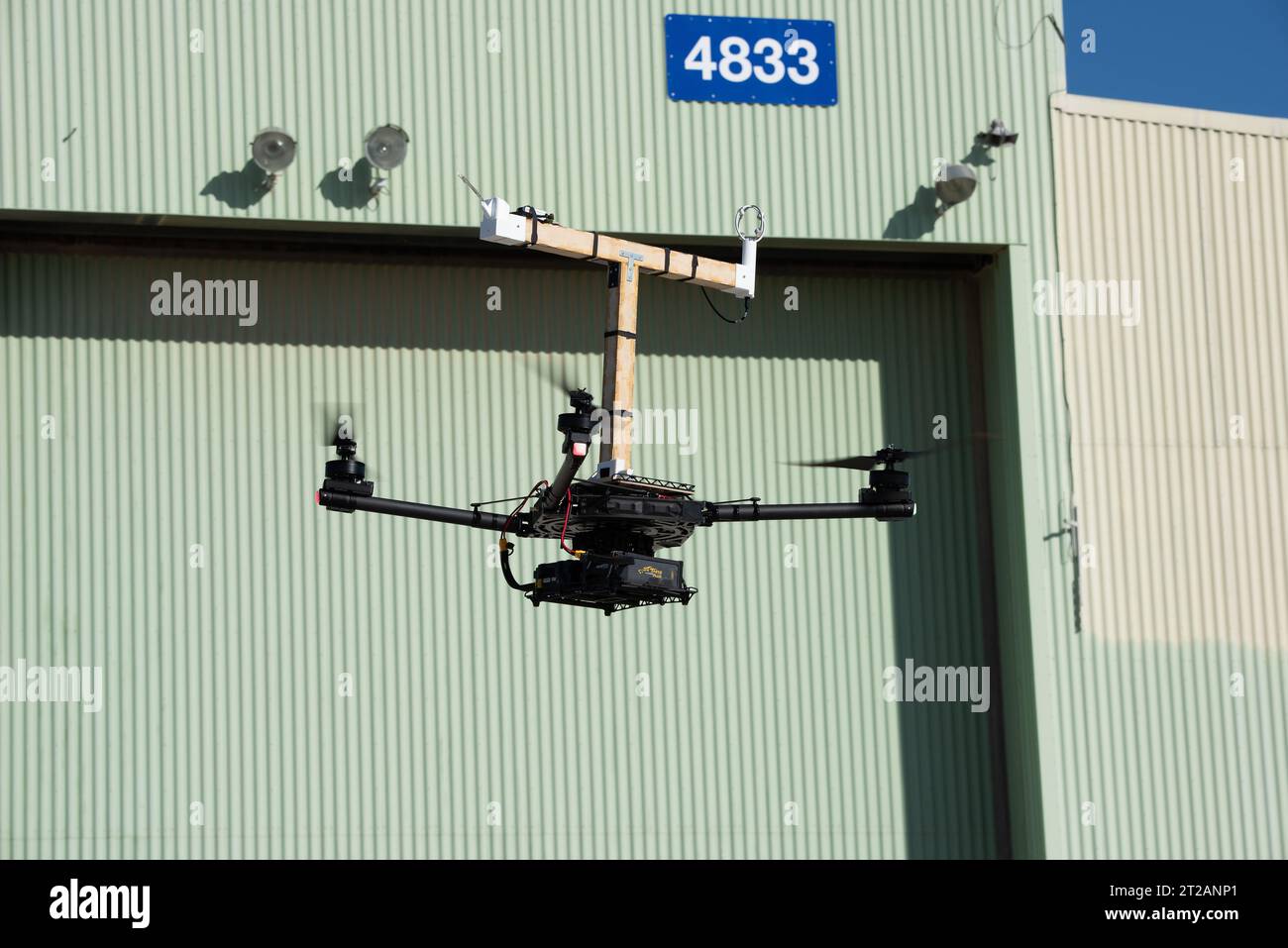 . The Alta-X aircraft flies by the former space shuttle hangar at NASA ...