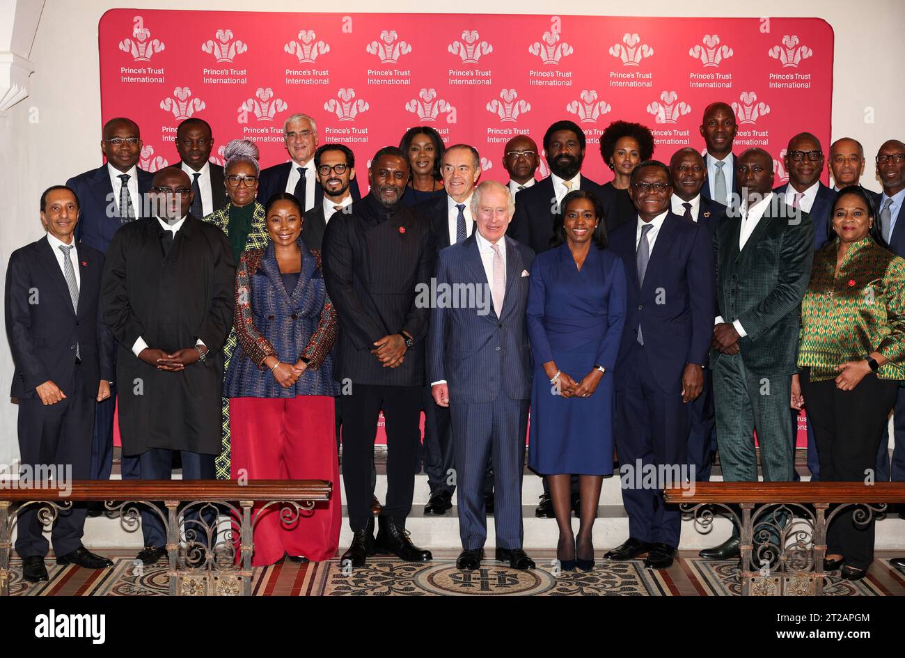 King Charles III (centre) poses with guests during a reception and discussion to learn about ...