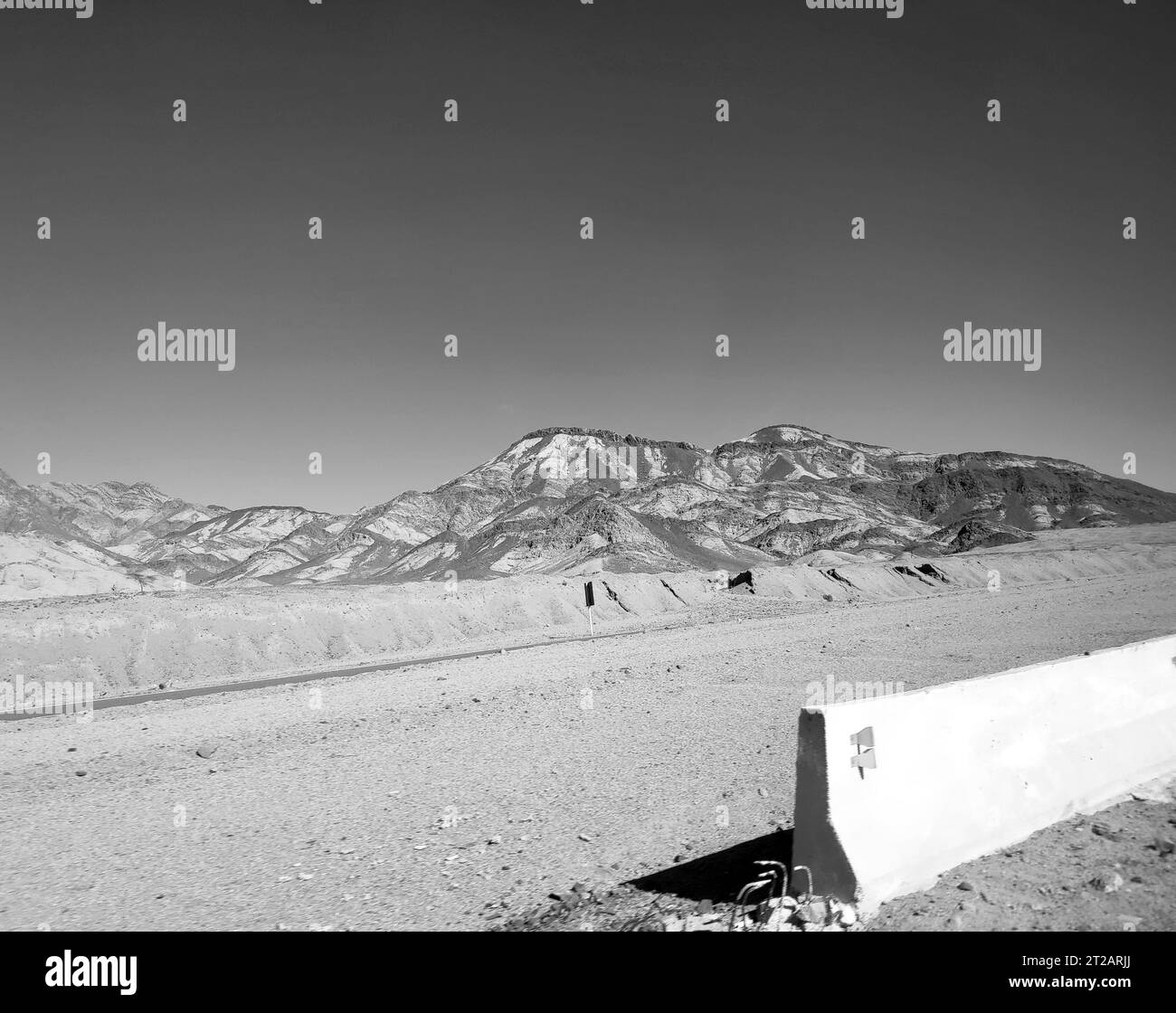 Border line in the desert, picturesque background with mountains and ...