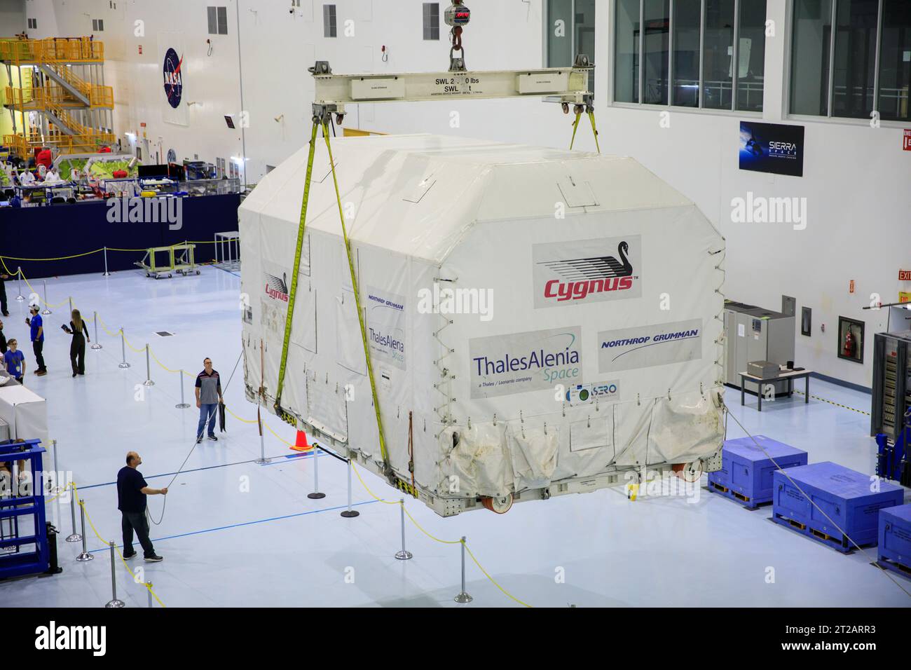 Cygnus Pressurized Cargo Module Arrival. A crane is used to lift the ...