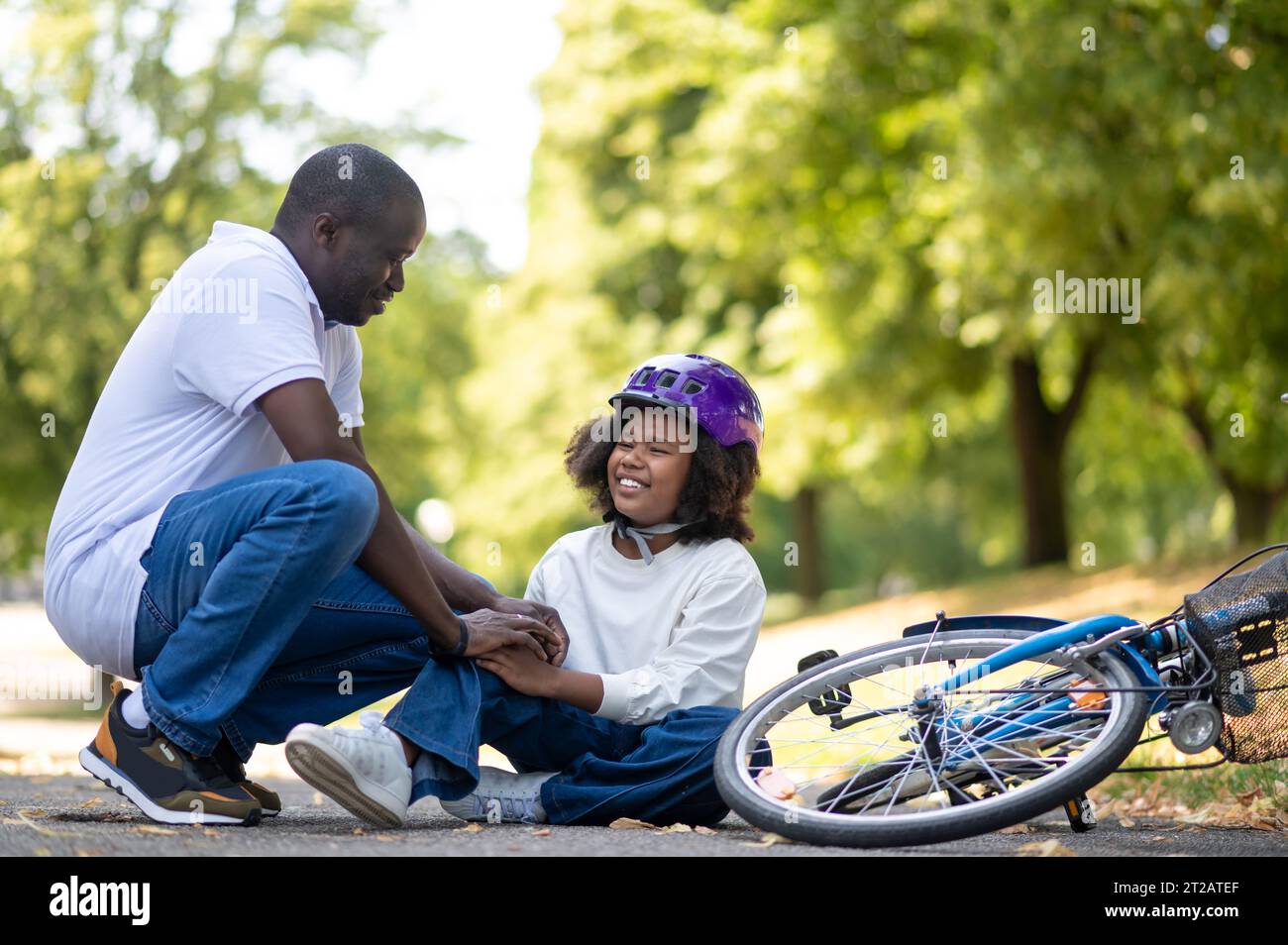 Accident father helping kid hi-res stock photography and images - Alamy