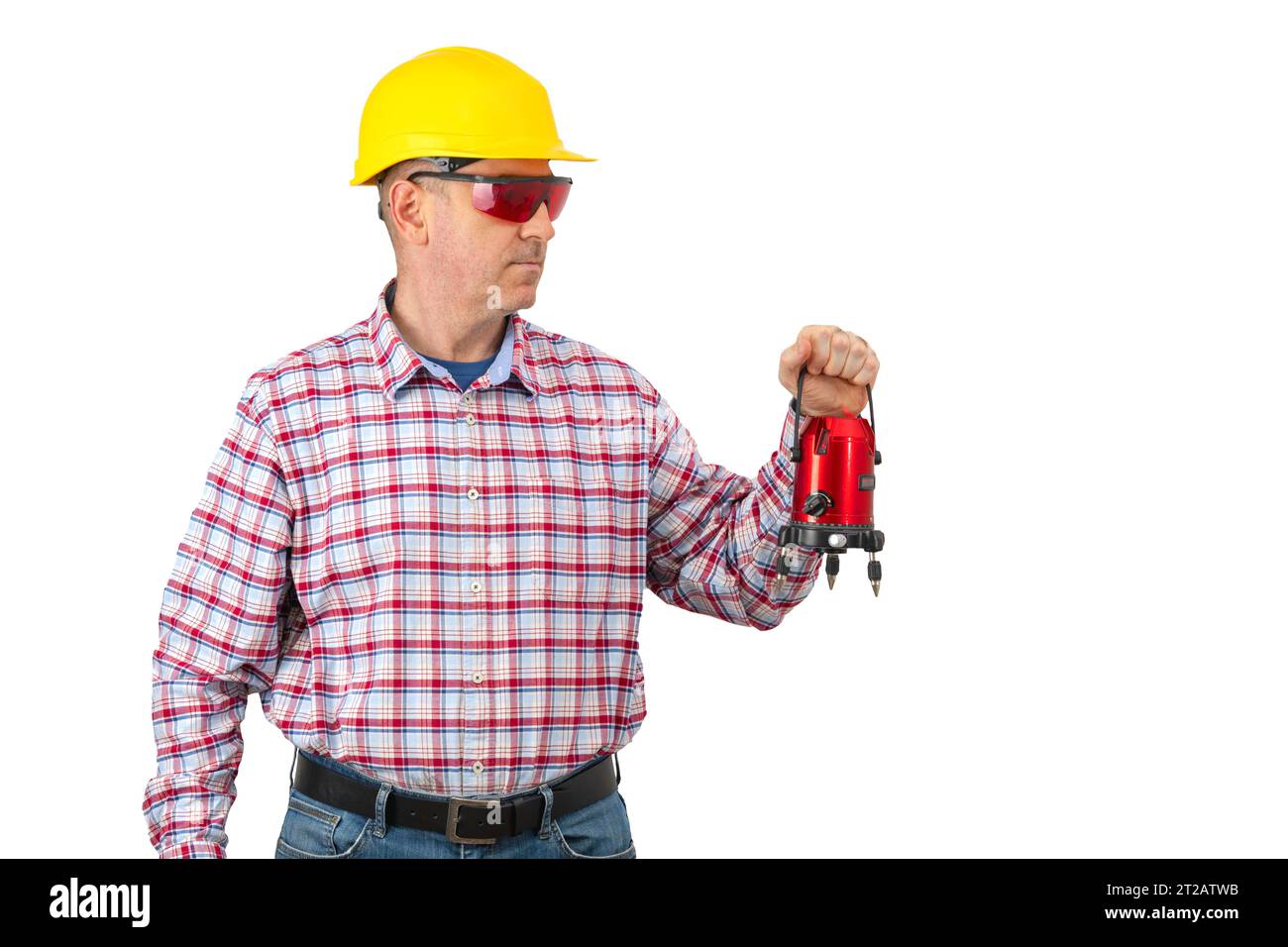 Builder man with laser level side view. measuring with laser level ...