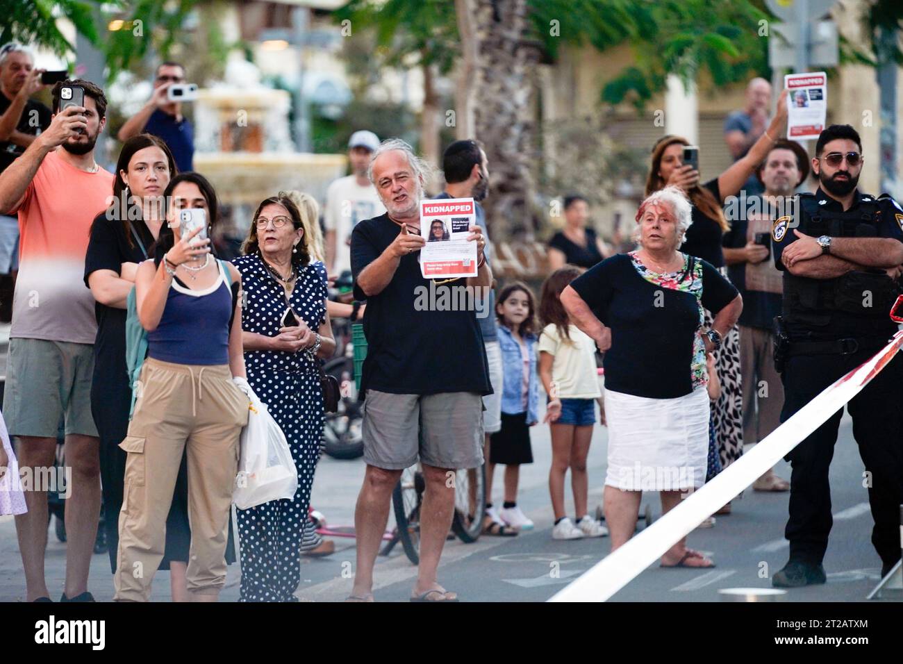 People watch as President Joe Biden's motorcade drives past to the ...
