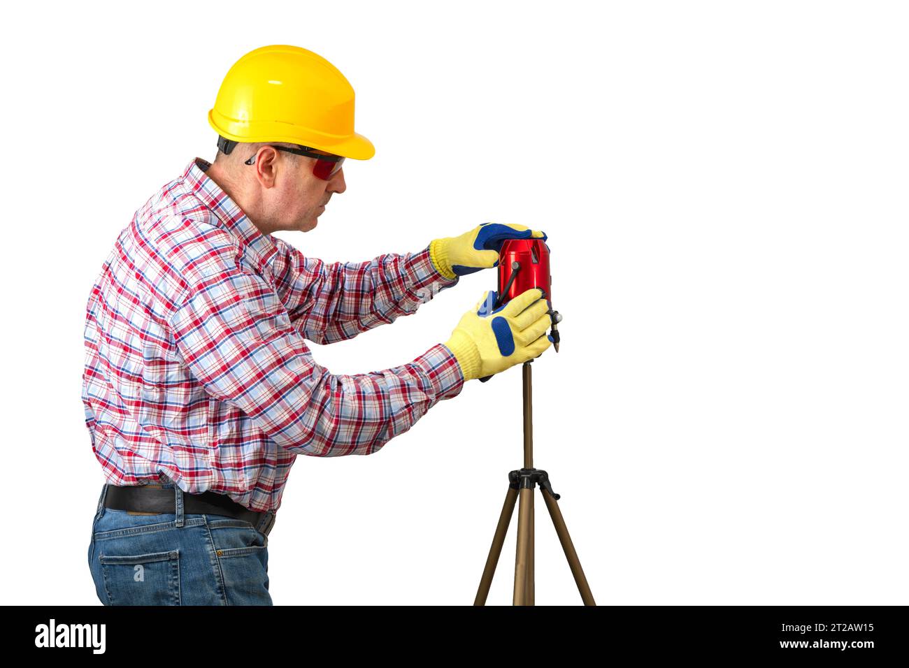 Builder man with laser level side view. measuring with laser level ...
