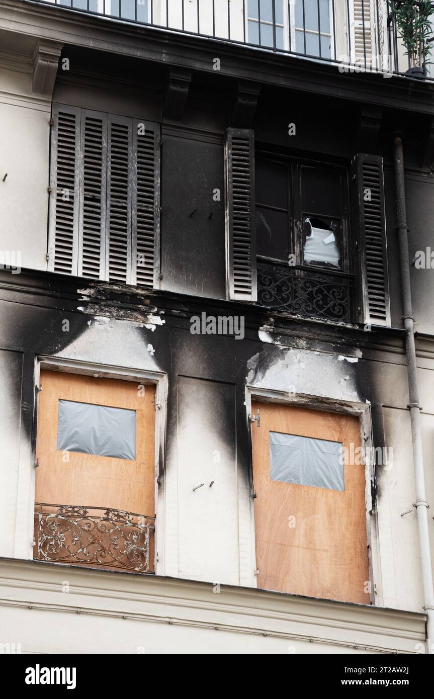 Typical Parisian building exterior after fire. Burnt charred wall ...