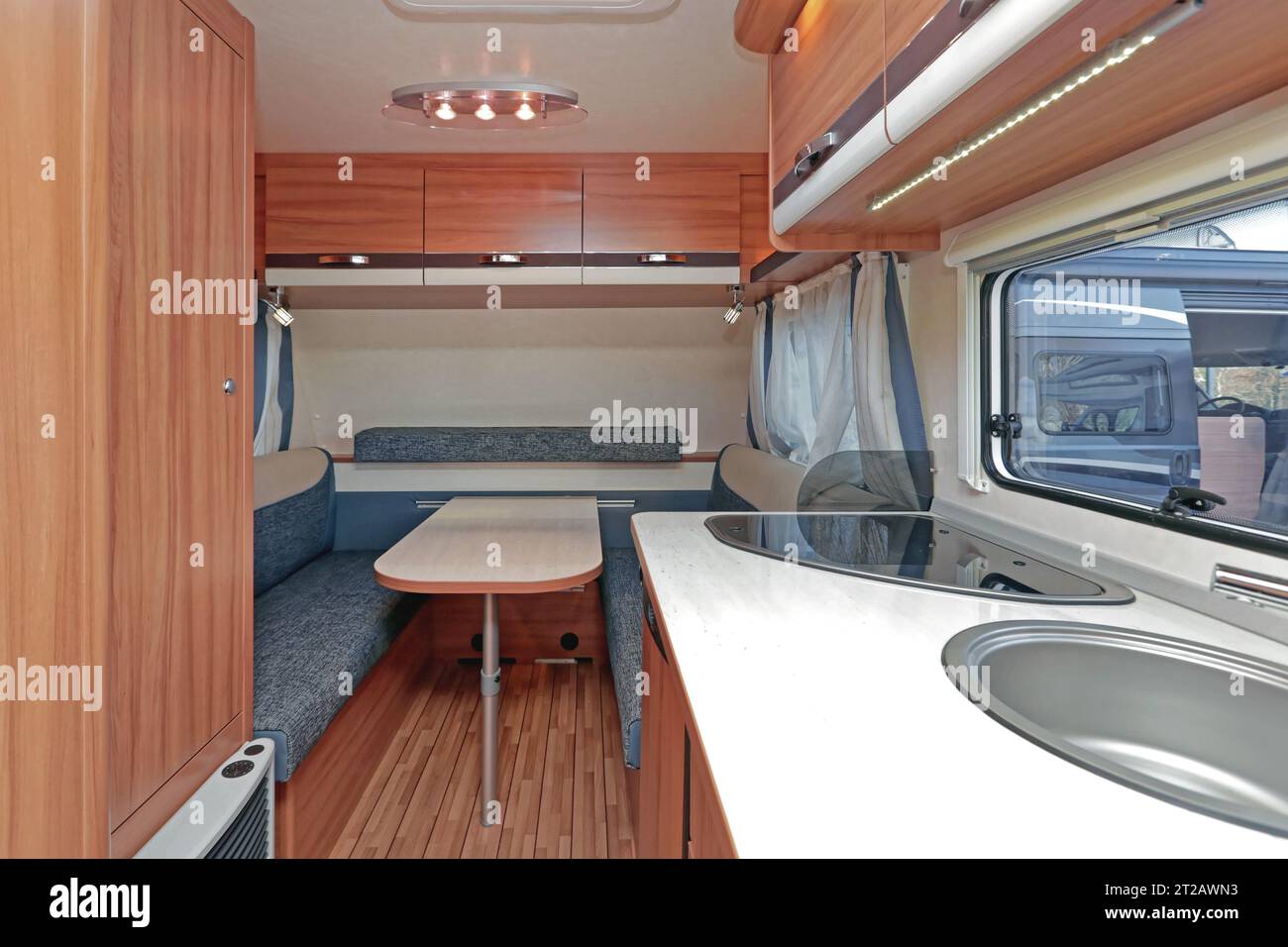 Kitchen Counter and Rear Dining Table in Camping Van Interior Stock ...