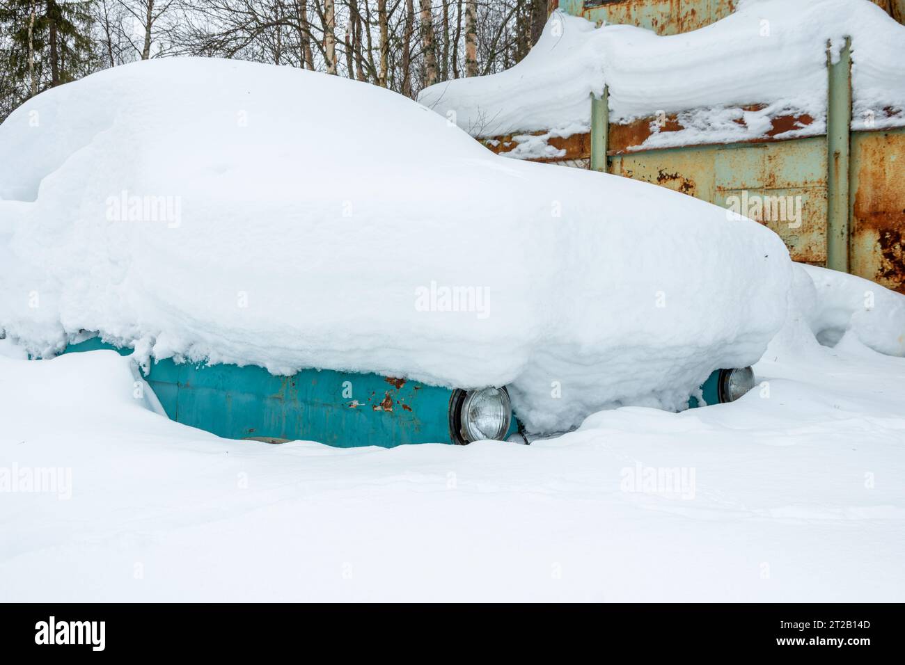 Car under the snow. A lot of snow after a snowfall. The car is ...