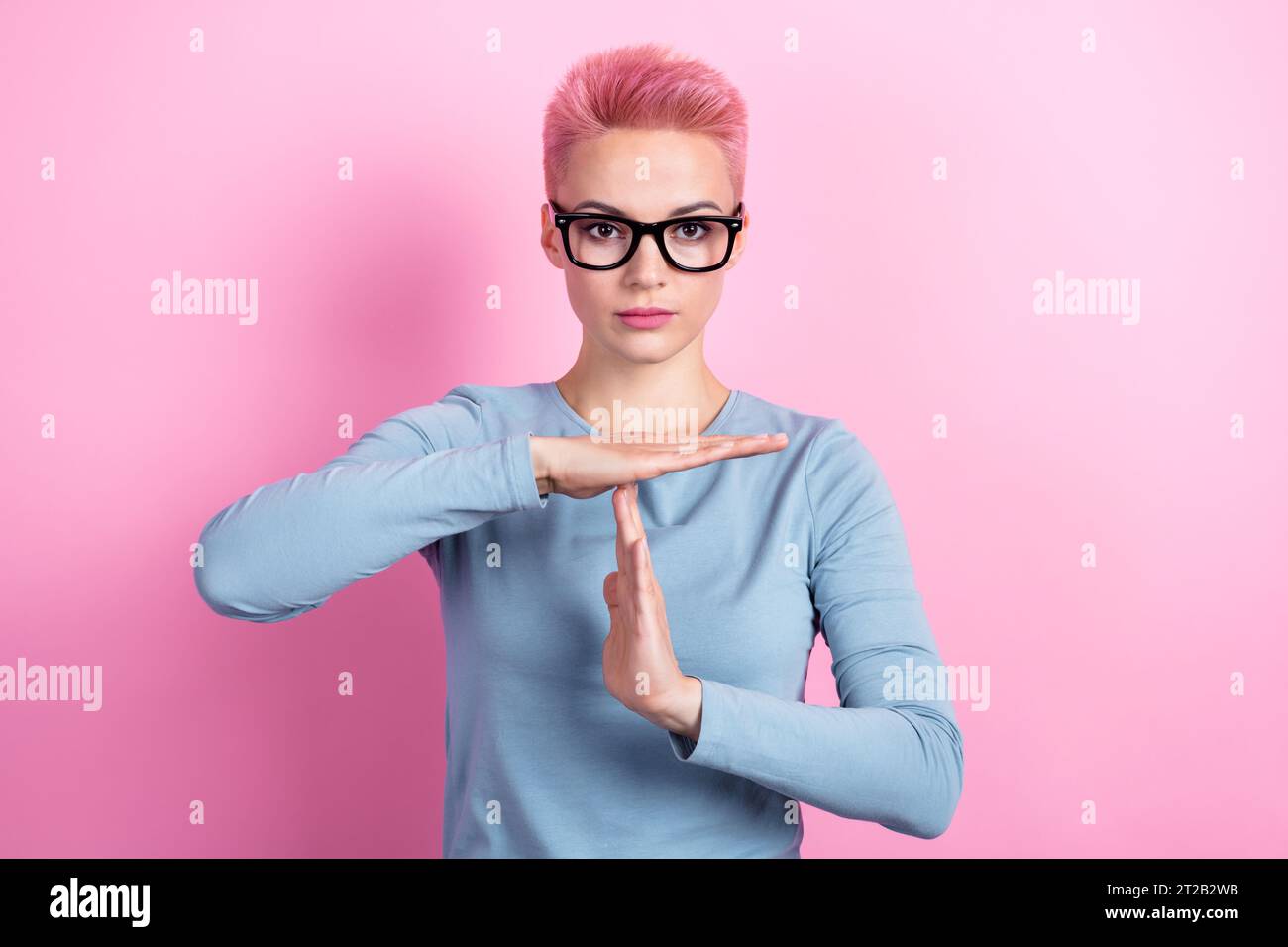 Portrait of gorgeous lady referee wear blue clothes demonstrate two ...