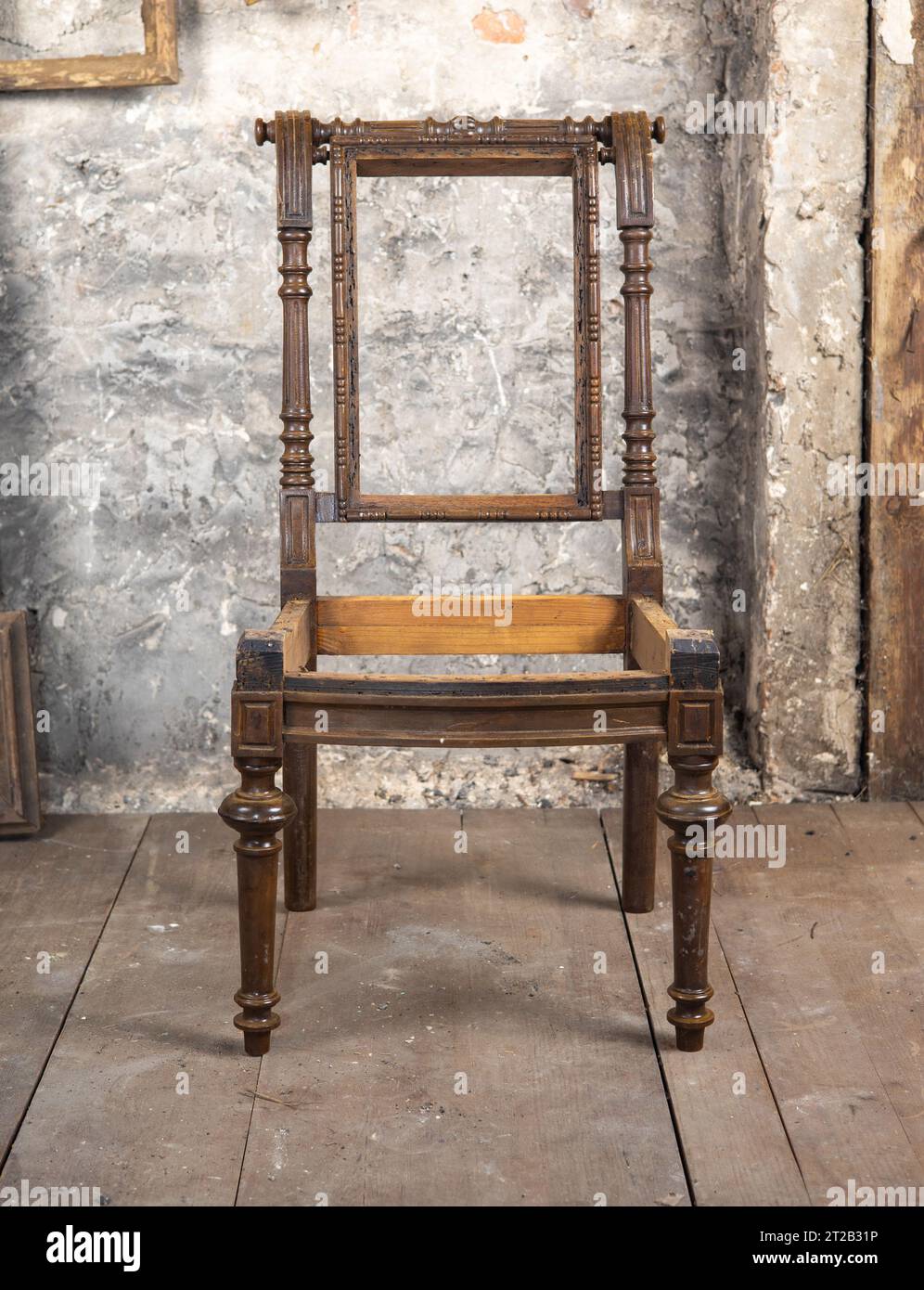 Vintage style . Defective old broken chair in an old dirty room with ...