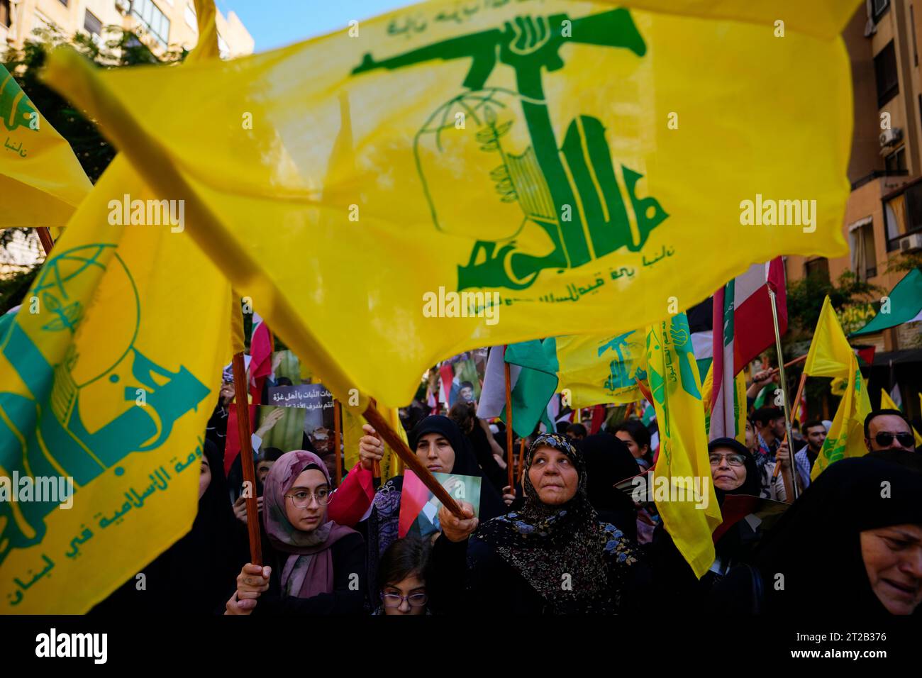Hezbollah supporters wave Hezbollah flags during a protest in ...
