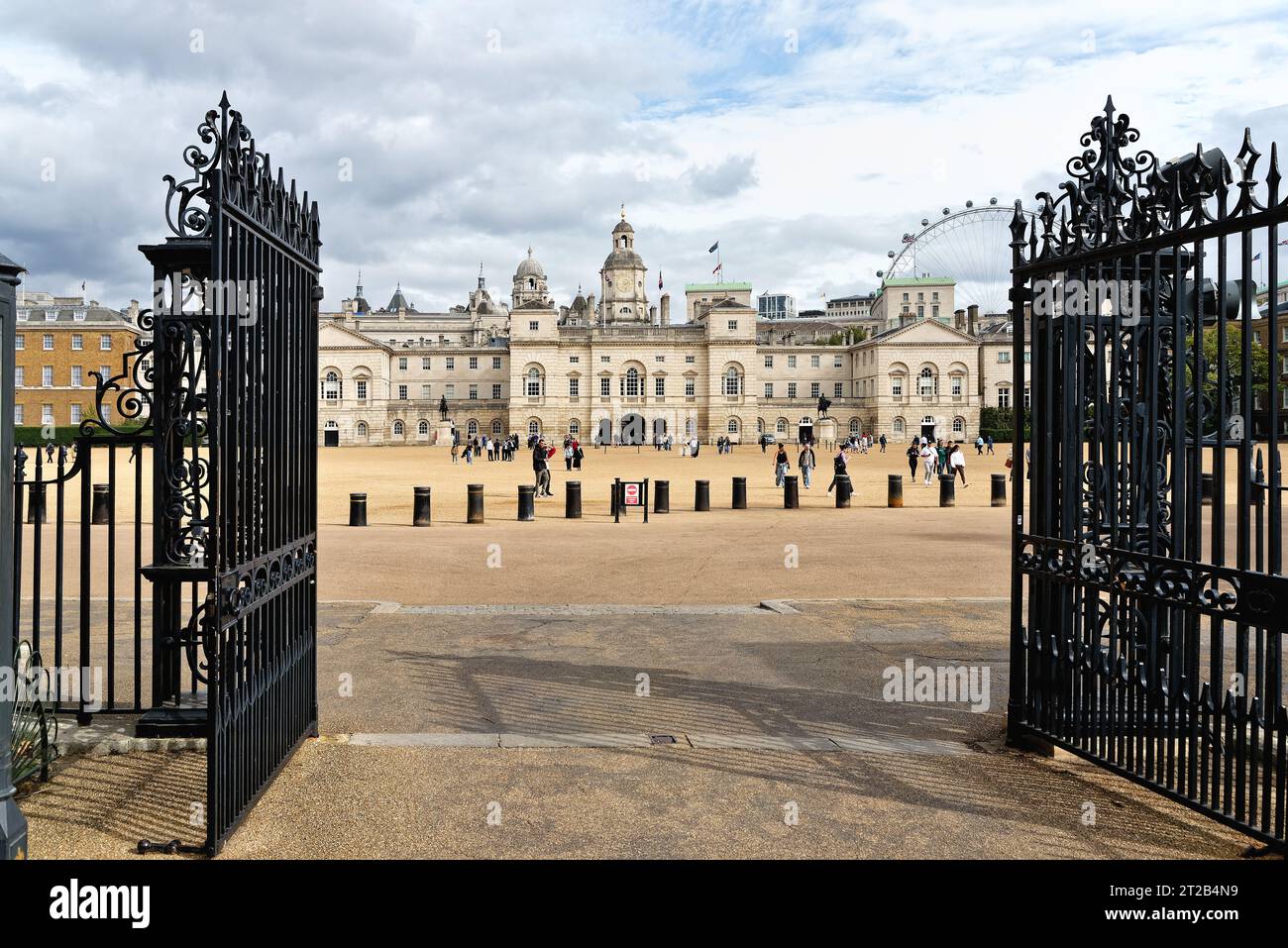 Tourists wandering around on Horse Guards Parade on a summers day, in ...