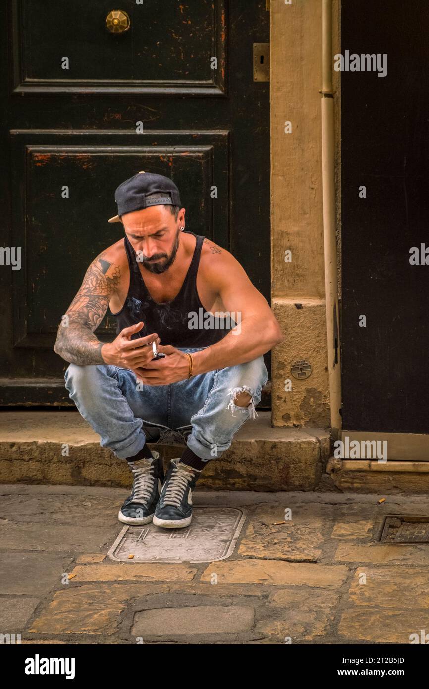 Man sitting on stoop hi-res stock photography and images - Alamy