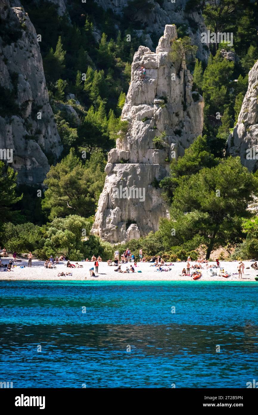 A crowded beach in one of the famous calanques near Cassis, southern ...