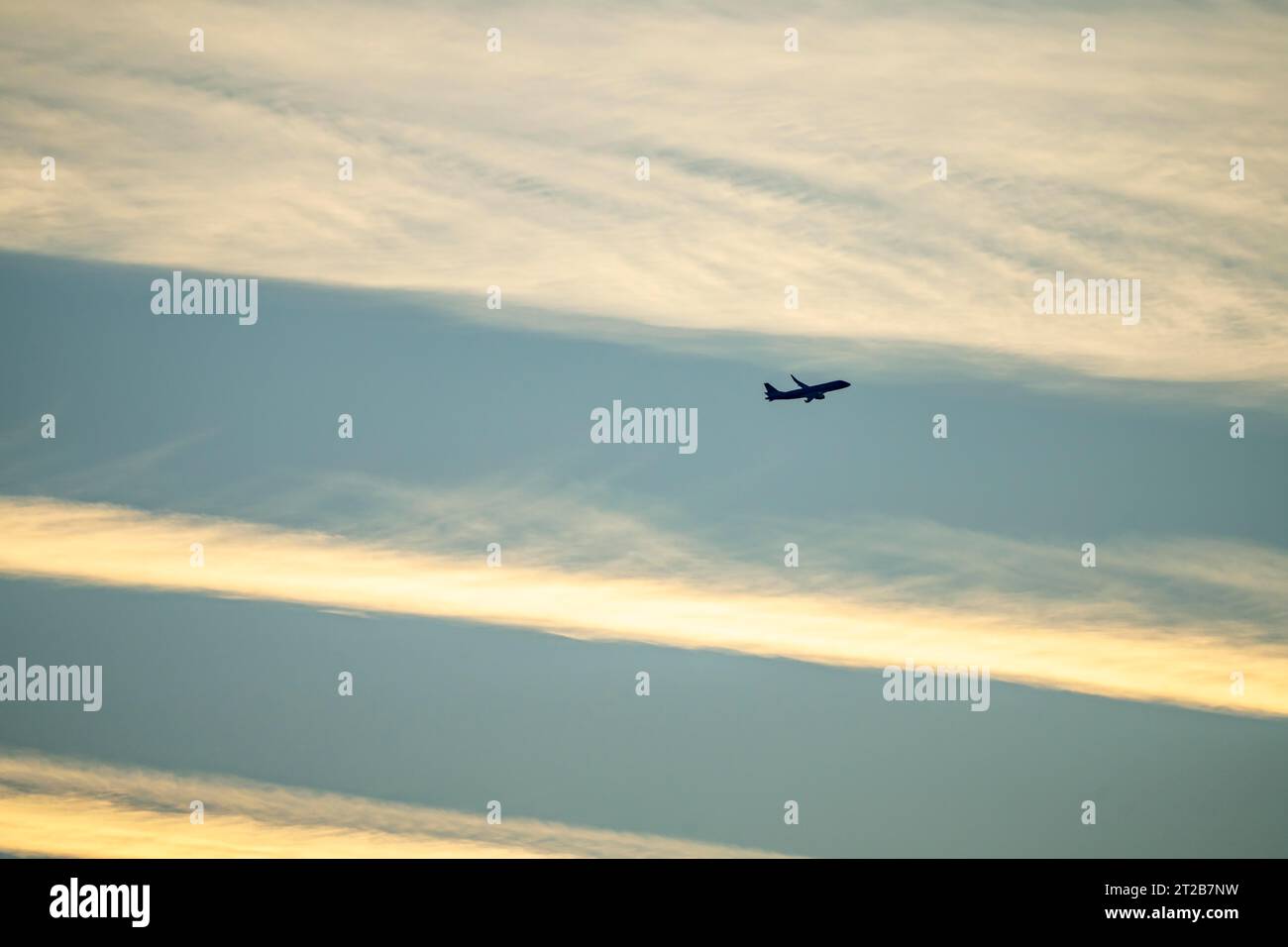 Passenger aircraft with contrails hi-res stock photography and images ...