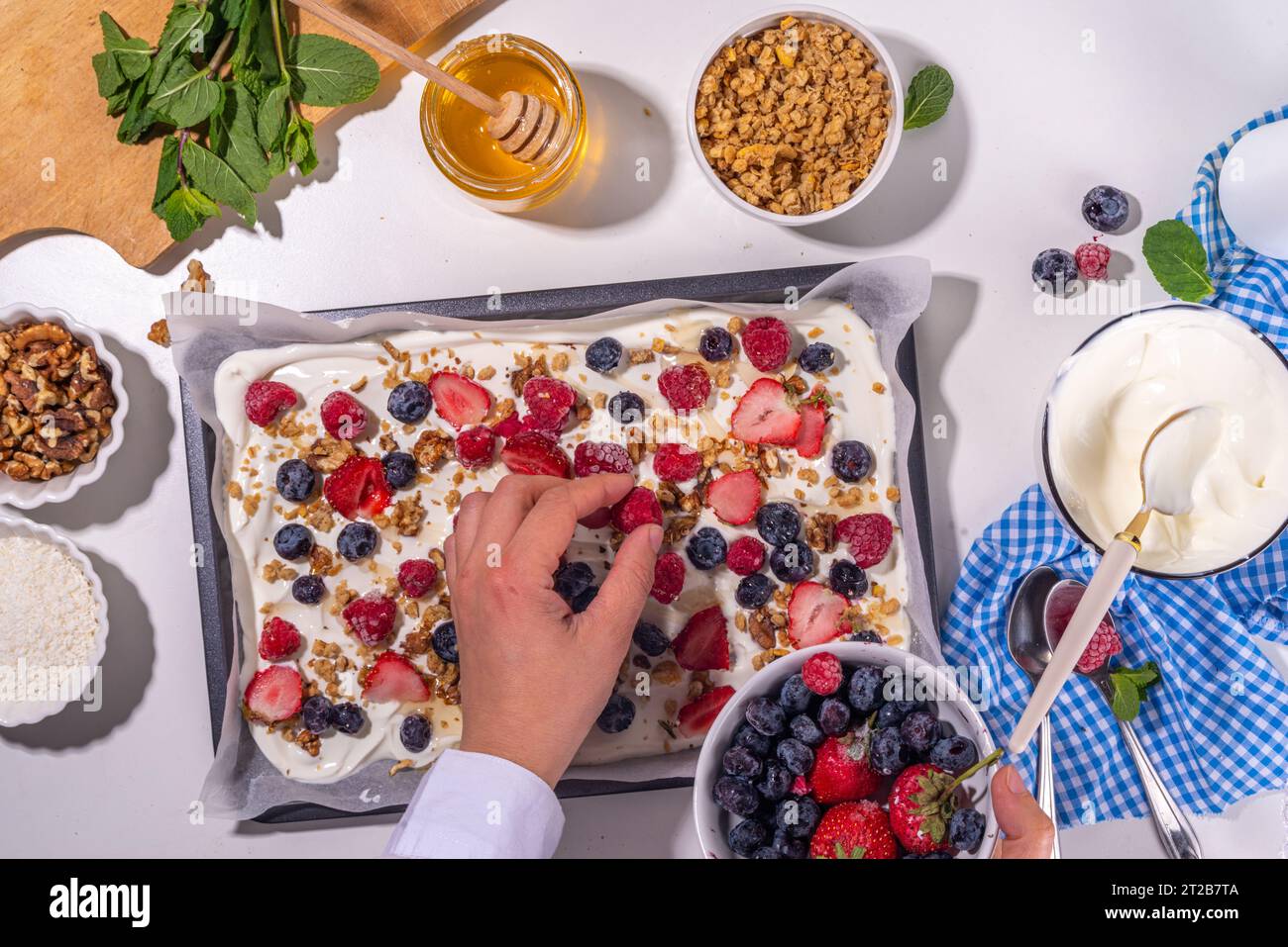 Cooking making Frozen Yogurt Bark background with greek yogurt, fresh ...