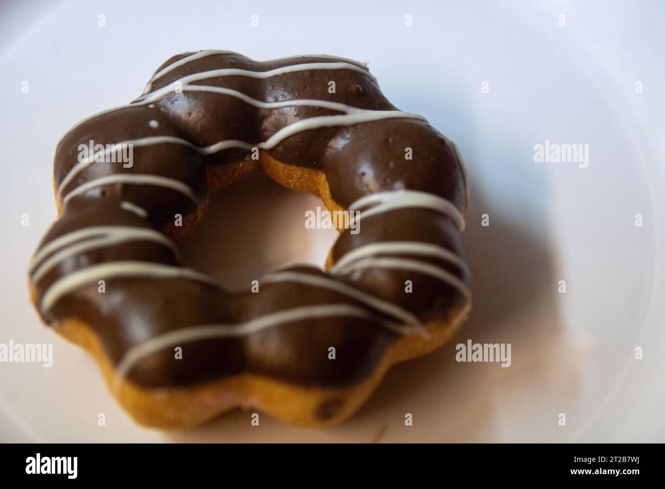 Chocolate Mochi Donut with vanilla drizzle Stock Photo - Alamy