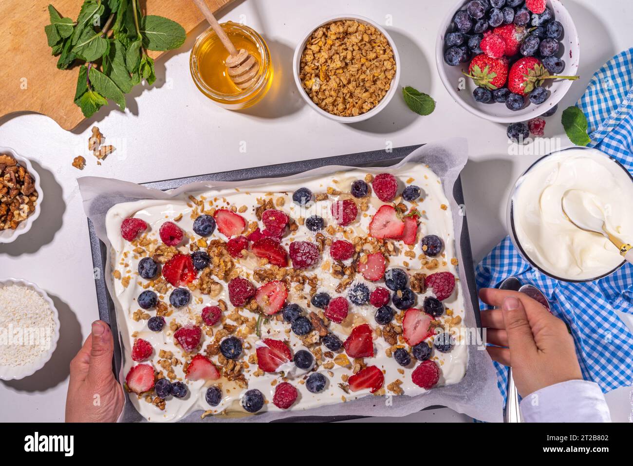 Cooking making Frozen Yogurt Bark background with greek yogurt, fresh ...