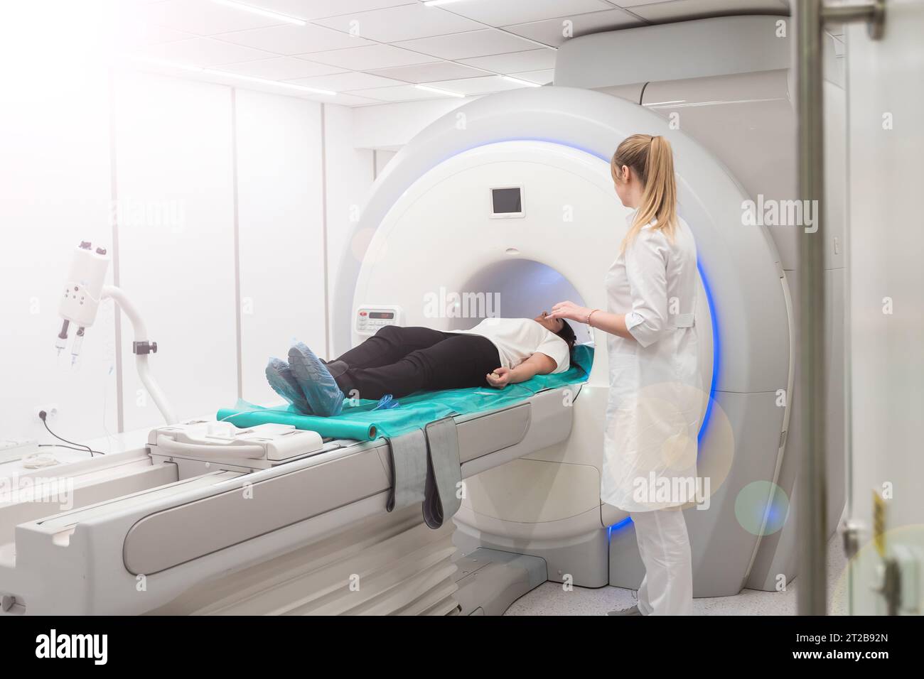 Female patient undergoing MRI - Magnetic resonance imaging in Hospital ...
