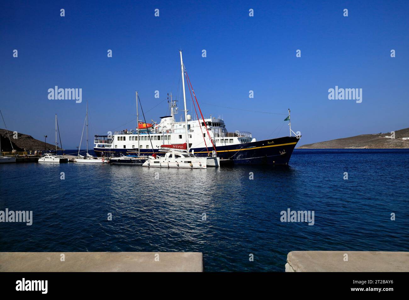 Boats at Livadia harbour, Tilos. May / June 2023 Stock Photo - Alamy