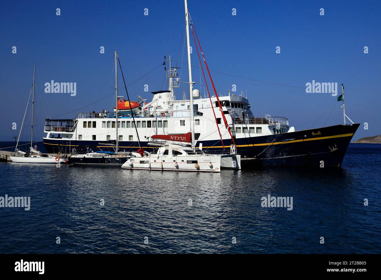 Boats at Livadia harbour, Tilos. May / June 2023 Stock Photo - Alamy