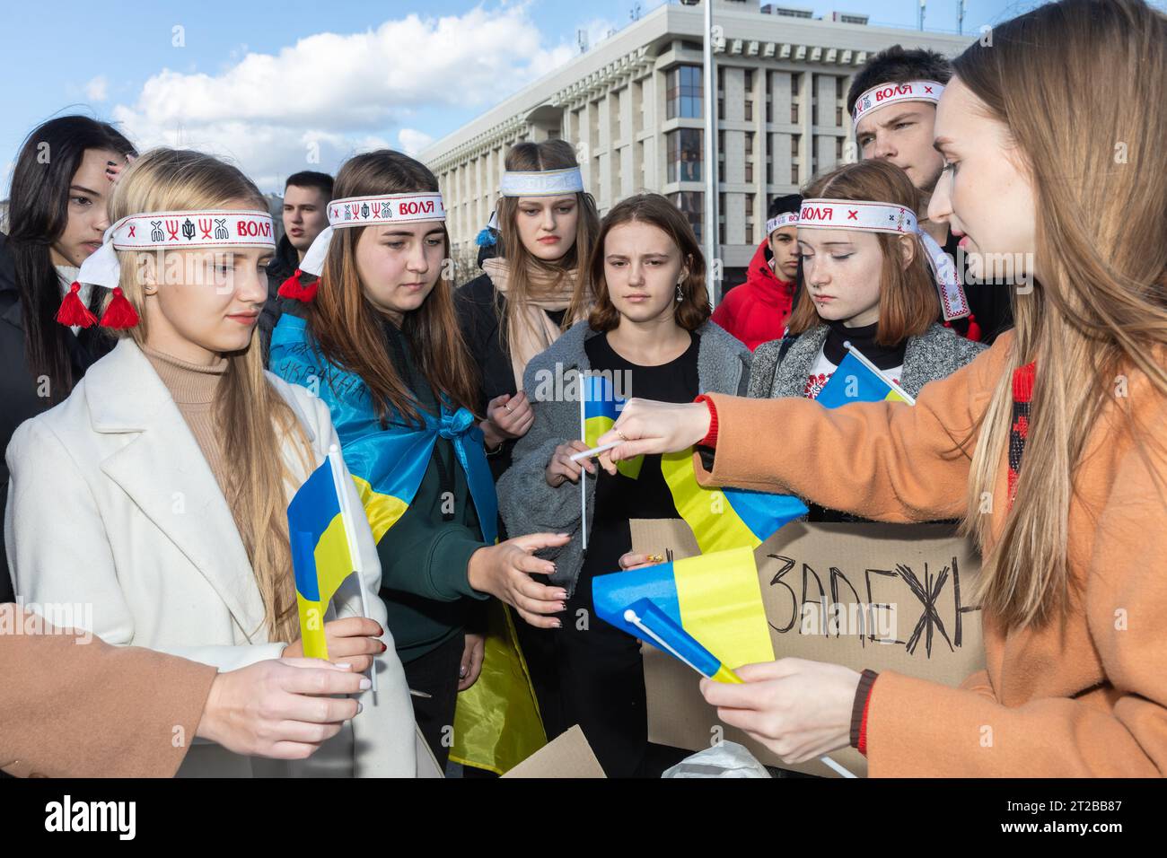A group of students are seen wearing headbands with the word Volya ...