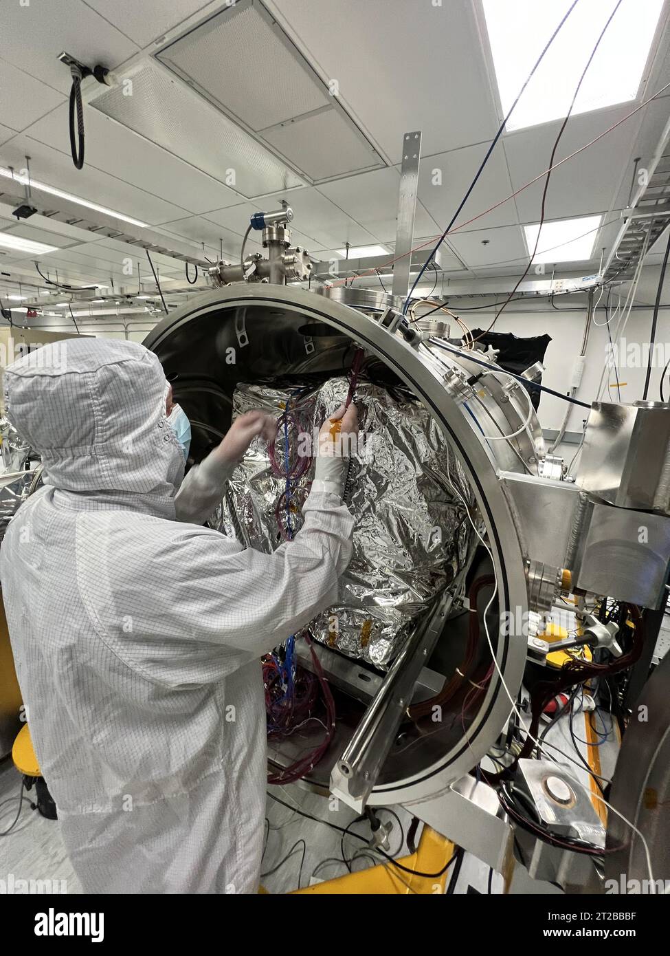 . Imaging Spectrometer Vacuum Chamber Test. An engineer prepares the ...