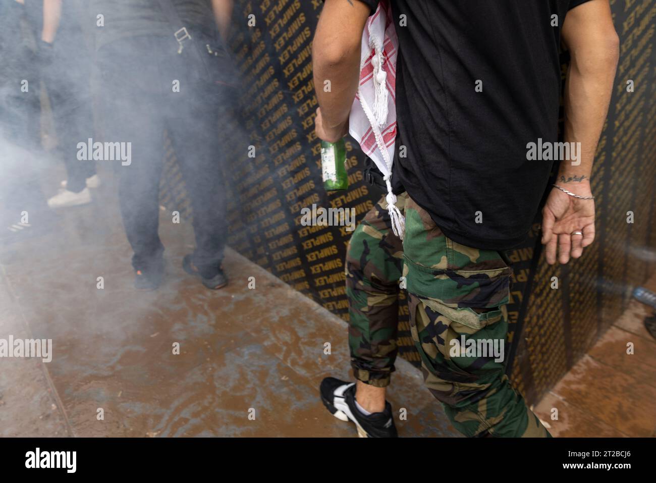 Awkar, Lebanon. 18th Oct, 2023. A demonstrator carries a Molotov ...