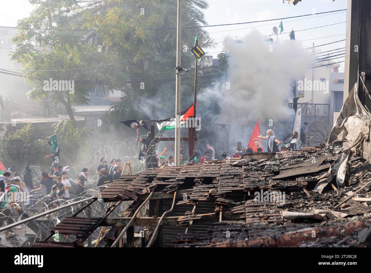 Awkar, Lebanon. 18th Oct, 2023. Demonstrators are surrounded in teargas ...
