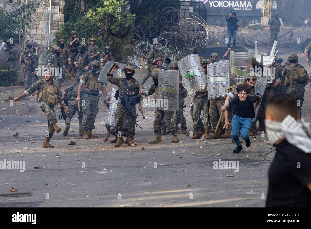 Awkar, Lebanon. 18th Oct, 2023. Lebanese Army soldiers throw rocks ...