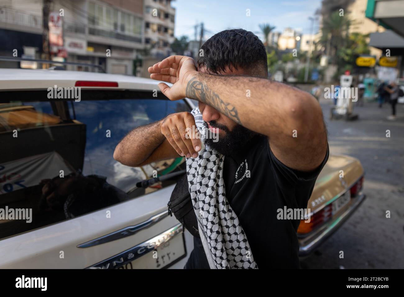 Awkar, Lebanon. 18th Oct, 2023. A demonstrate covers his face while ...