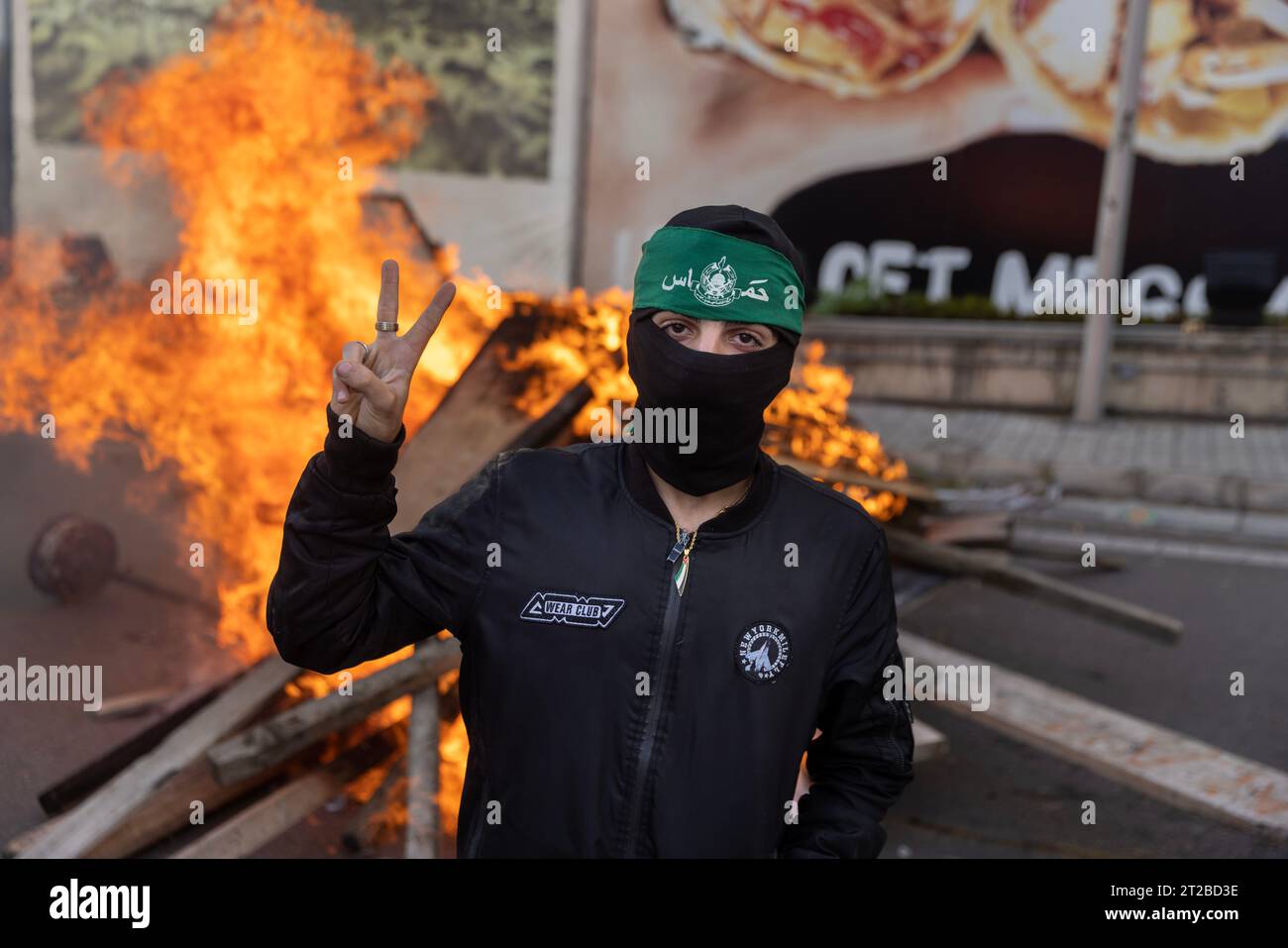 Awkar, Lebanon. 18th Oct, 2023. A demonstrator wearing a Hamas bandana ...