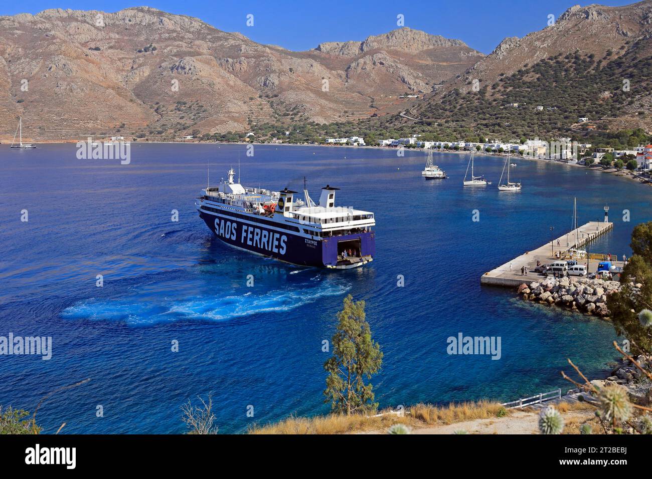 The Stavros ferry boat performing a tight turn and churning the sea to ...