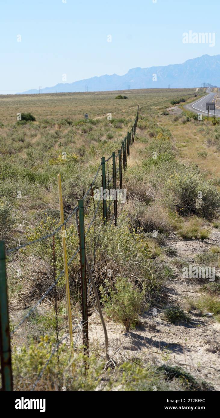 Fence Line in the desert Stock Photo - Alamy