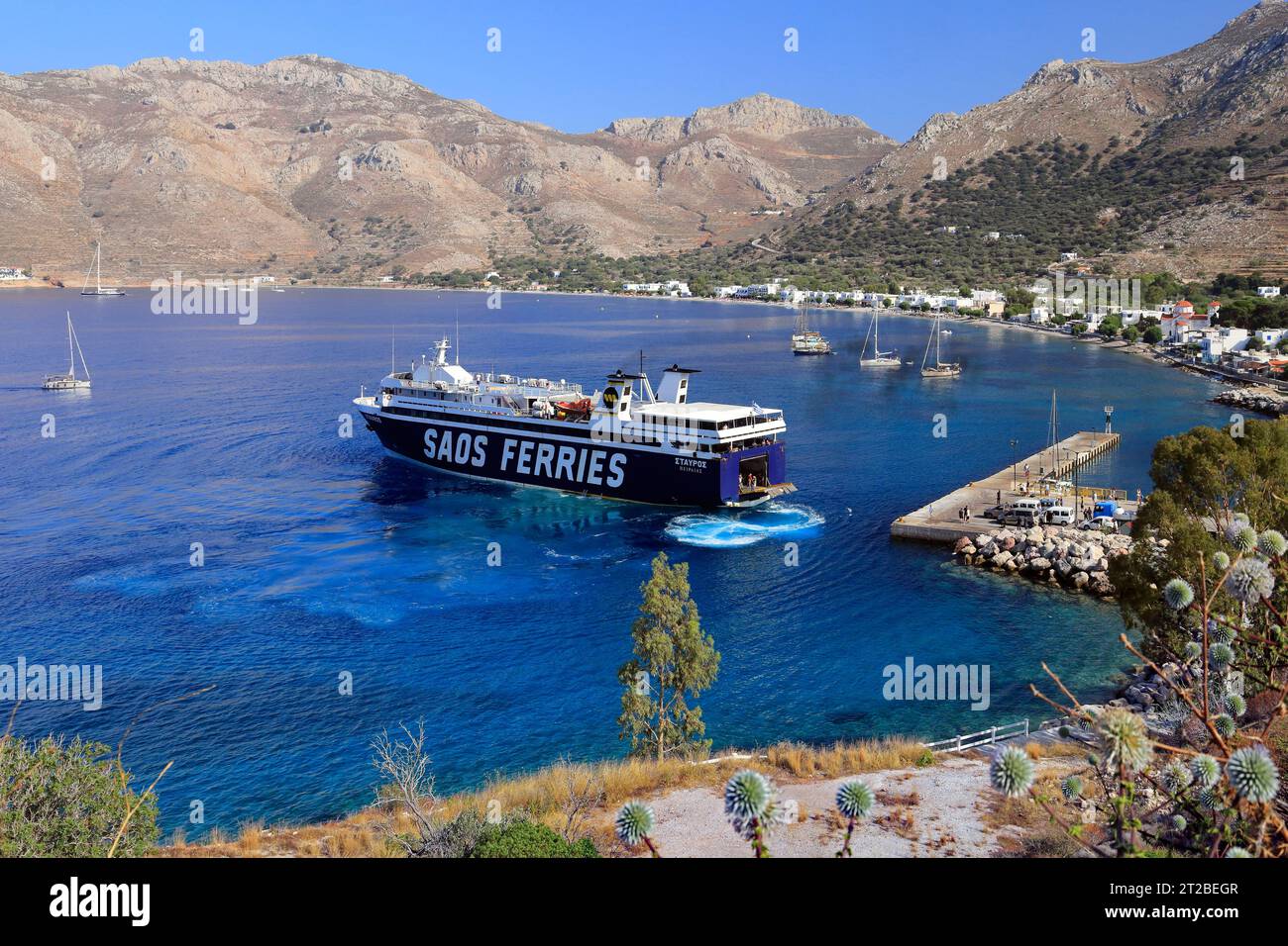 The Stavros ferry boat performing a tight turn and churning the sea to ...