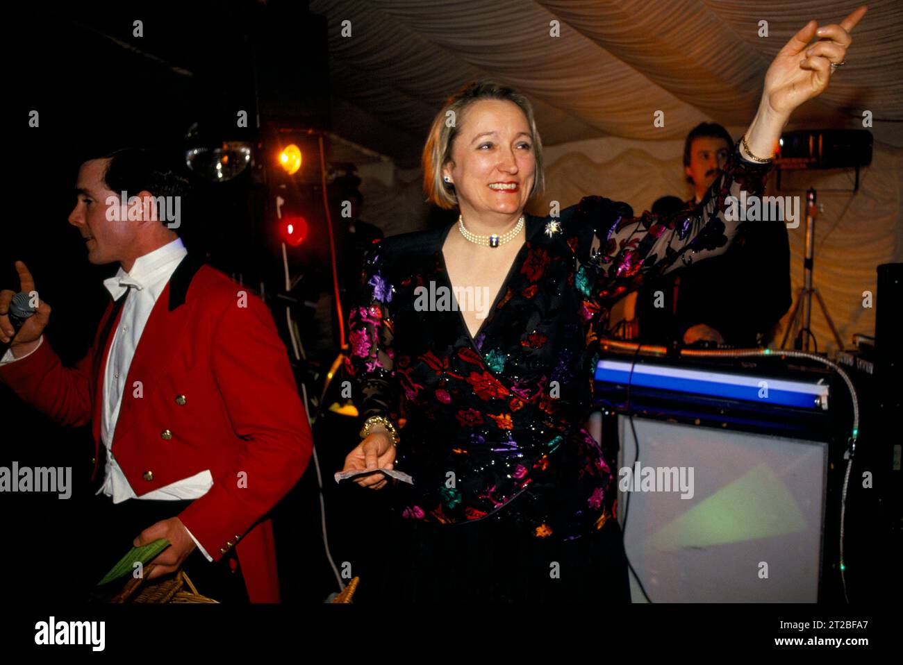 Charity Raffle Ticket Draw, woman calling out the winning numbers ...